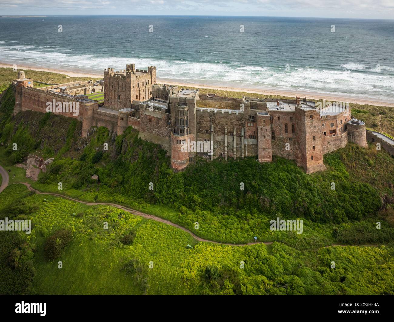 Aerial shot of the mighty Bamburgh Castle, Northumberland, England, UK ...