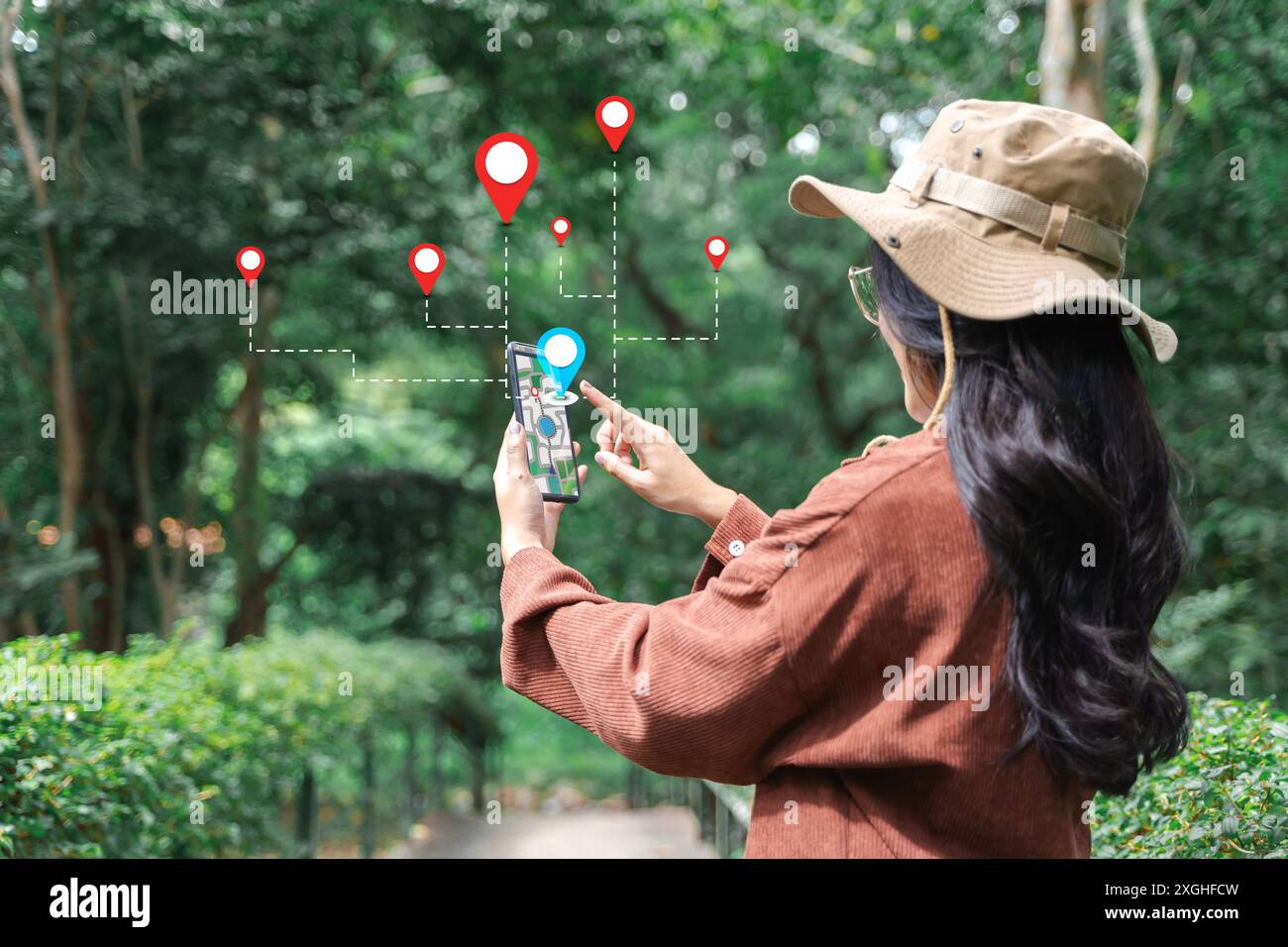 Using gps navigator app, forest hiking on mountain. Woman hands with a ...