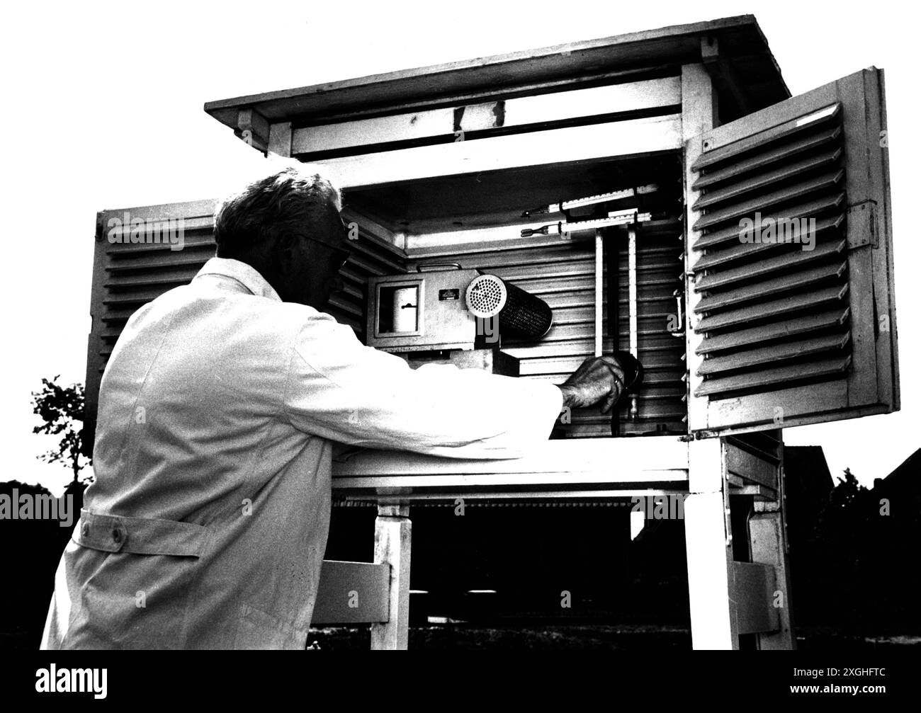 weather, weather station, meteorolog is reading instruments in the ...