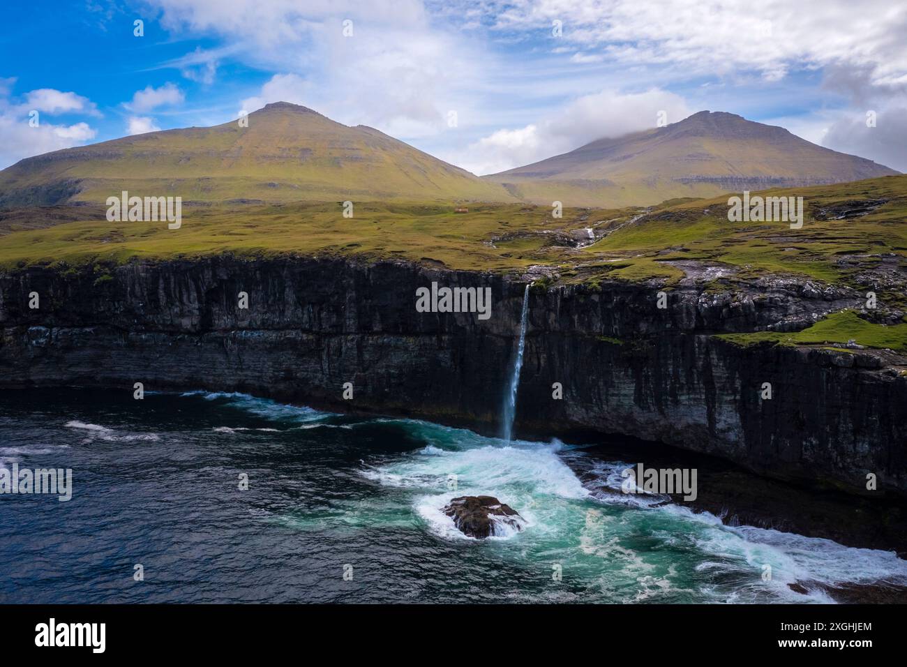 Aerial view of the wild coast near Eidi village. Eysturoy island, Faroe ...