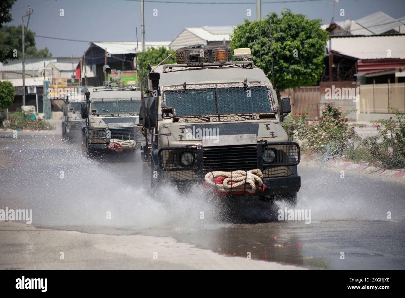 Explosions and smoke rise during Israeli army raid on the Nur Shams ...