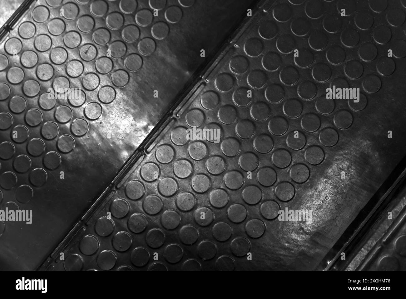 Rubber mat with a non-slip pattern covers an industrial stairway, top ...