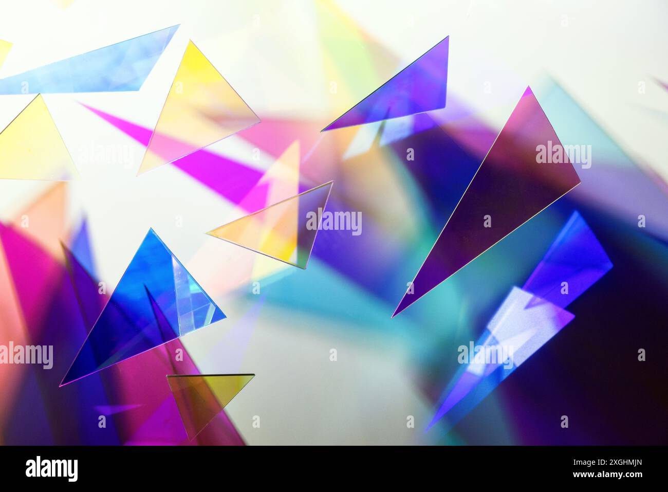 Abstract background photo with colorful transparent plastic triangles ...