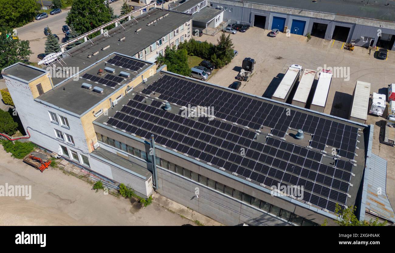 Drone photography of industrial warehouse and logistic vehicles parked ...