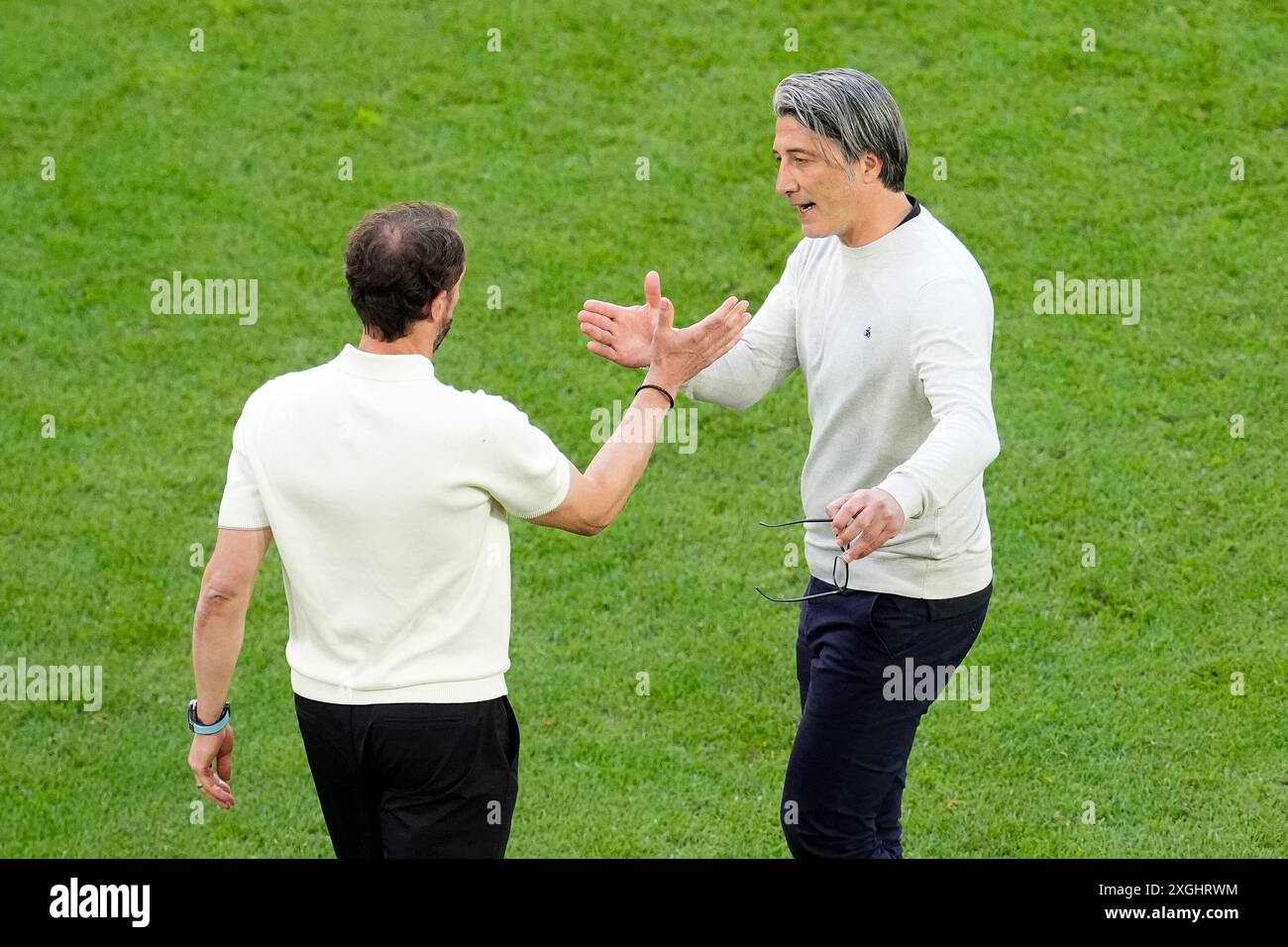 England manager Gareth Southgate (left) embraces Switzerland manager ...