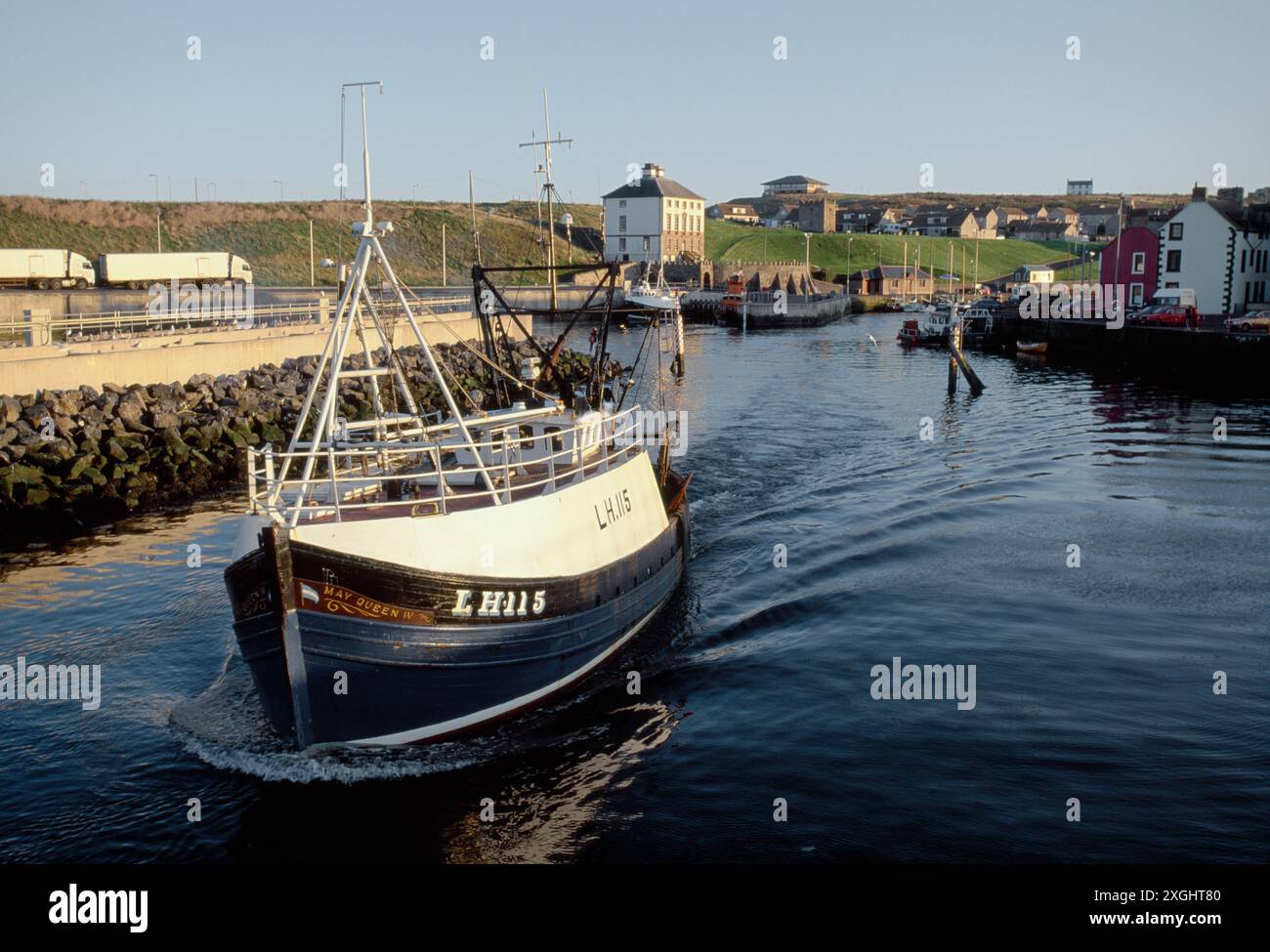 Fishing boat leaving Eyemouth harbour, Eyemouth, Berwickshire, Scotland ...
