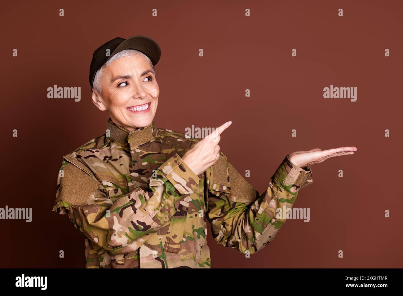 Photo of pensioner lady professional officer hold look point empty ...