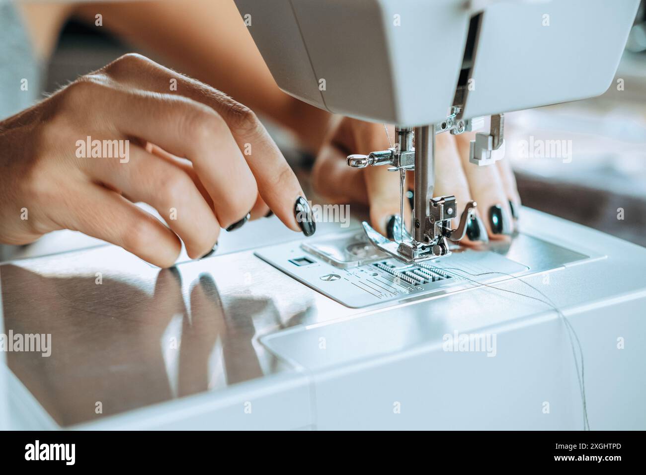 Threading a sewing machine hi-res stock photography and images - Alamy
