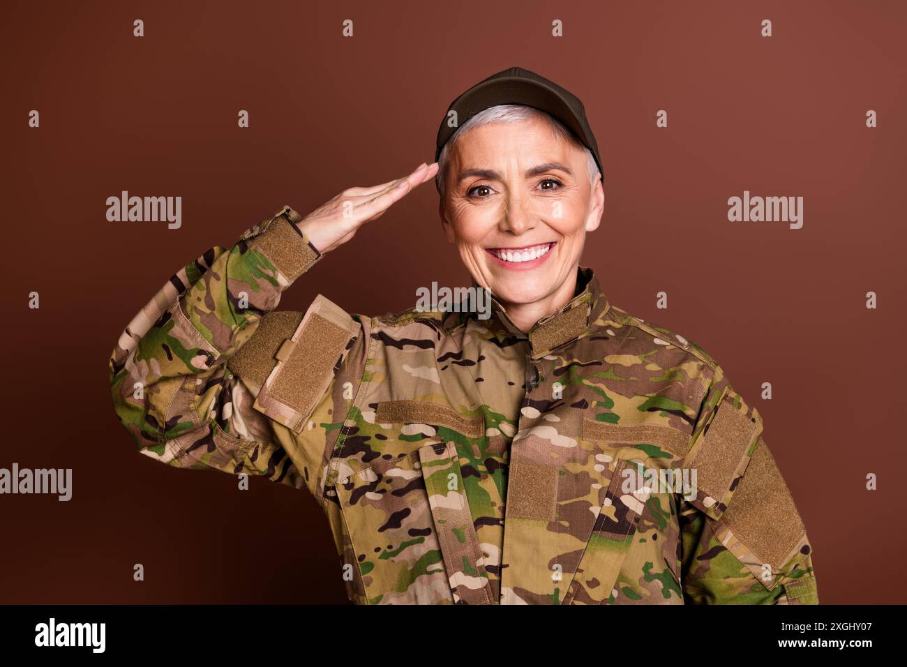 Photo of attractive smiling elderly lady dressed camo uniform showing ...
