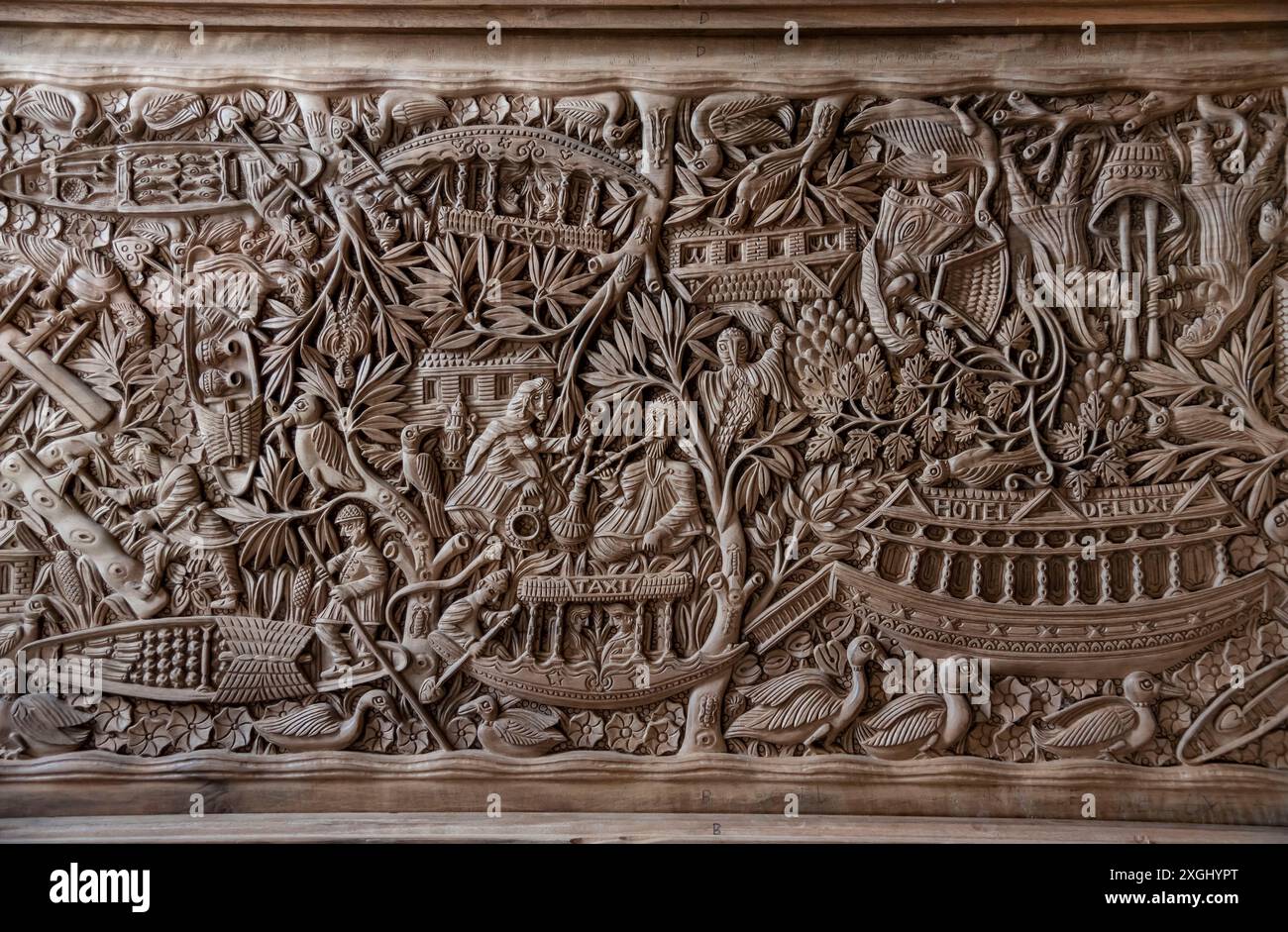A view of crafted artwork depicting Dal Lake on a walnut wood surface ...