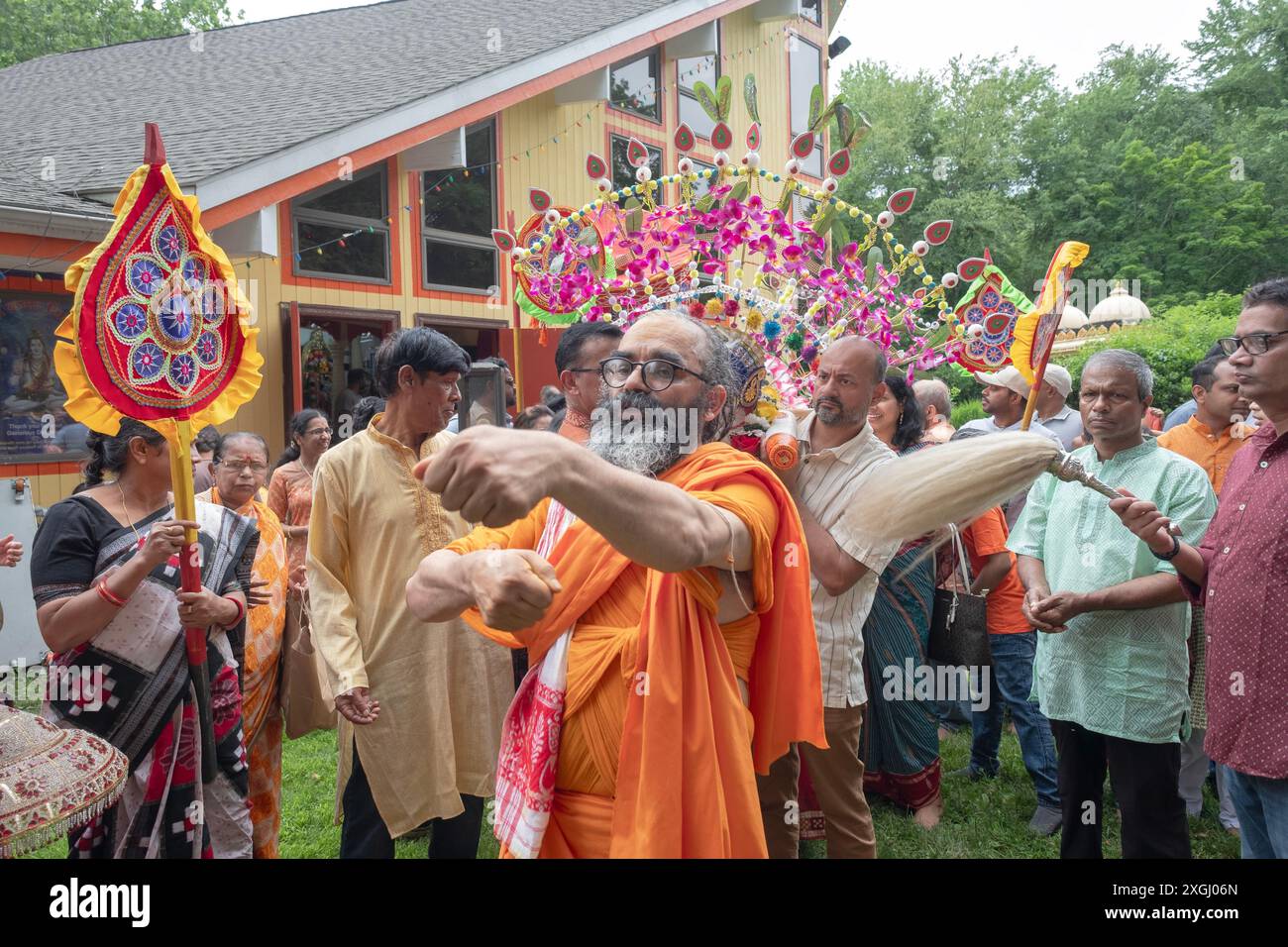 Swami Balgopal a priest & monk, leads a statue of the Hindu god Balaram ...