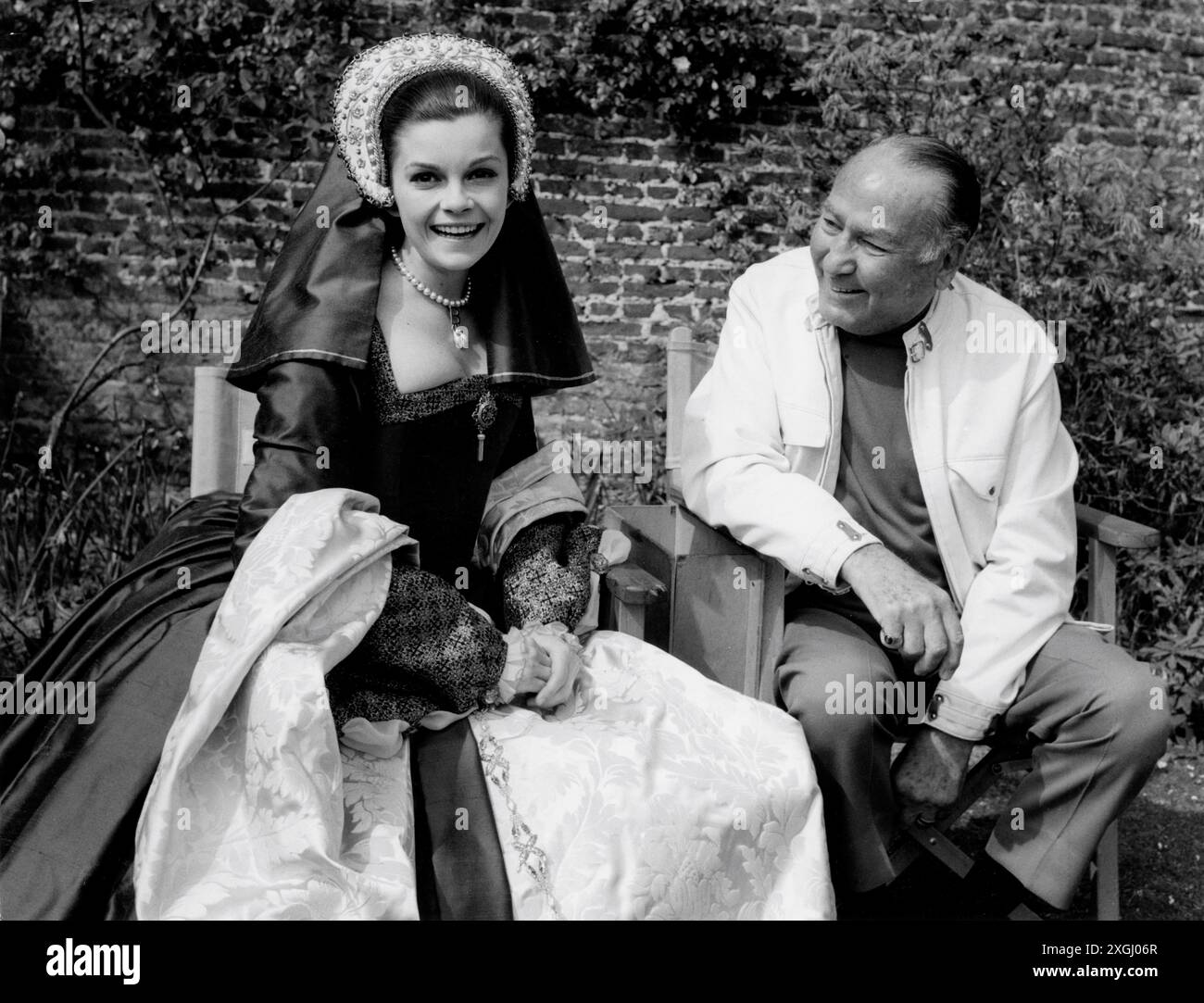 GENEVIEVE BUJOLD in costume as Anne Boleyn and Producer HAL B. WALLIS ...