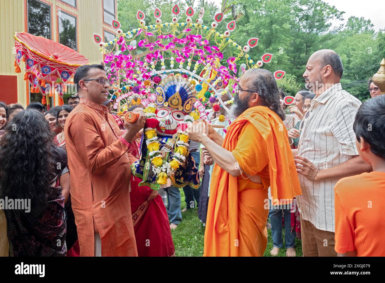 Swami Balgopal a priest & monk, carries a statue of the Hindu god ...