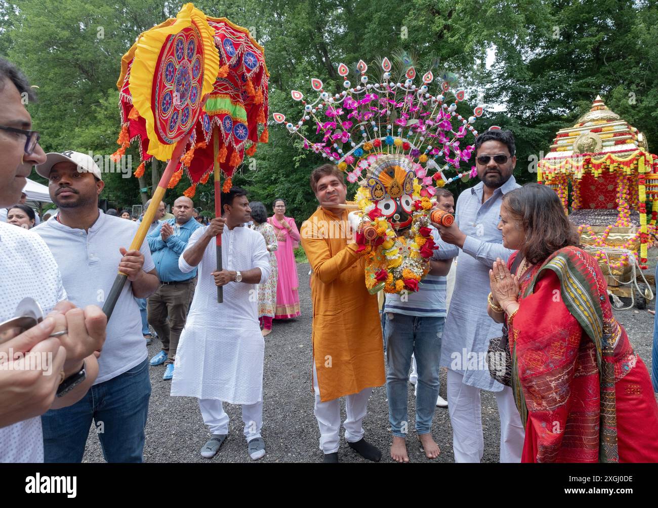 Hindu men carrying a statue of Jagannash to a service just before the ...