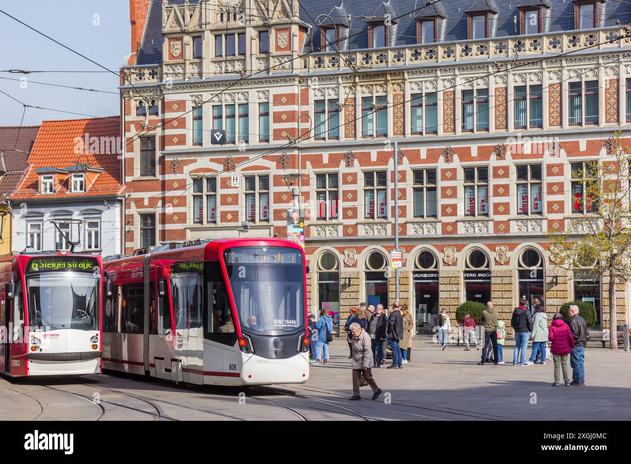 Trams in front of the post office on the Anger square in Erfurt ...