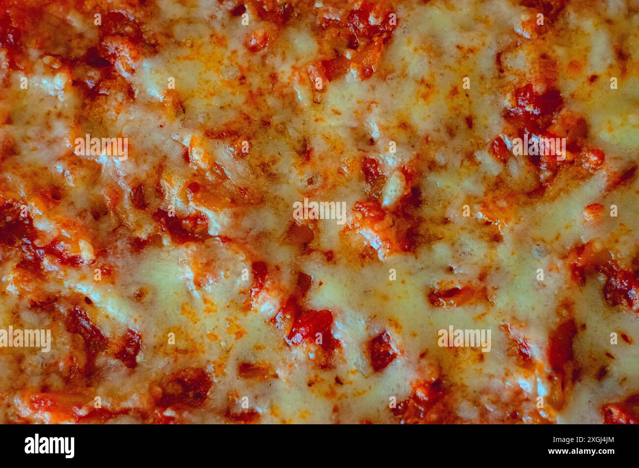 Cheesy Delight: Pizza with Melted Cheese and Tomato Stock Photo - Alamy