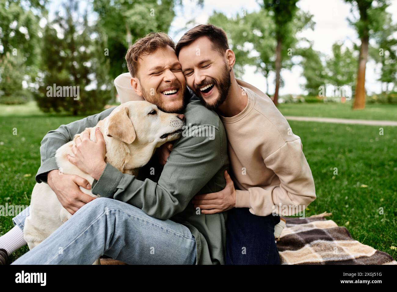 A bearded gay couple shares a laugh with their labrador dog while ...