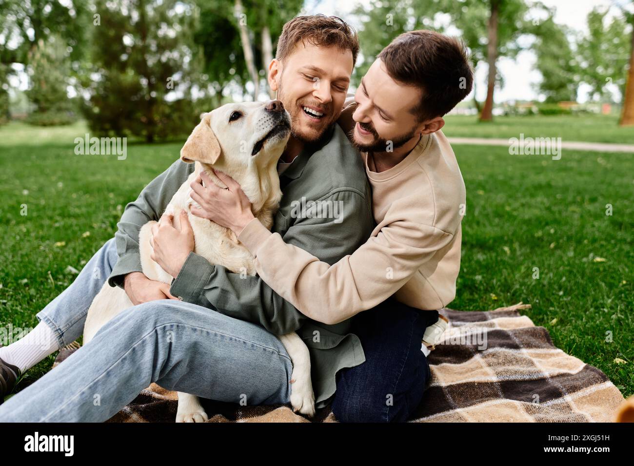 A bearded gay couple enjoys a picnic in a green park with their ...