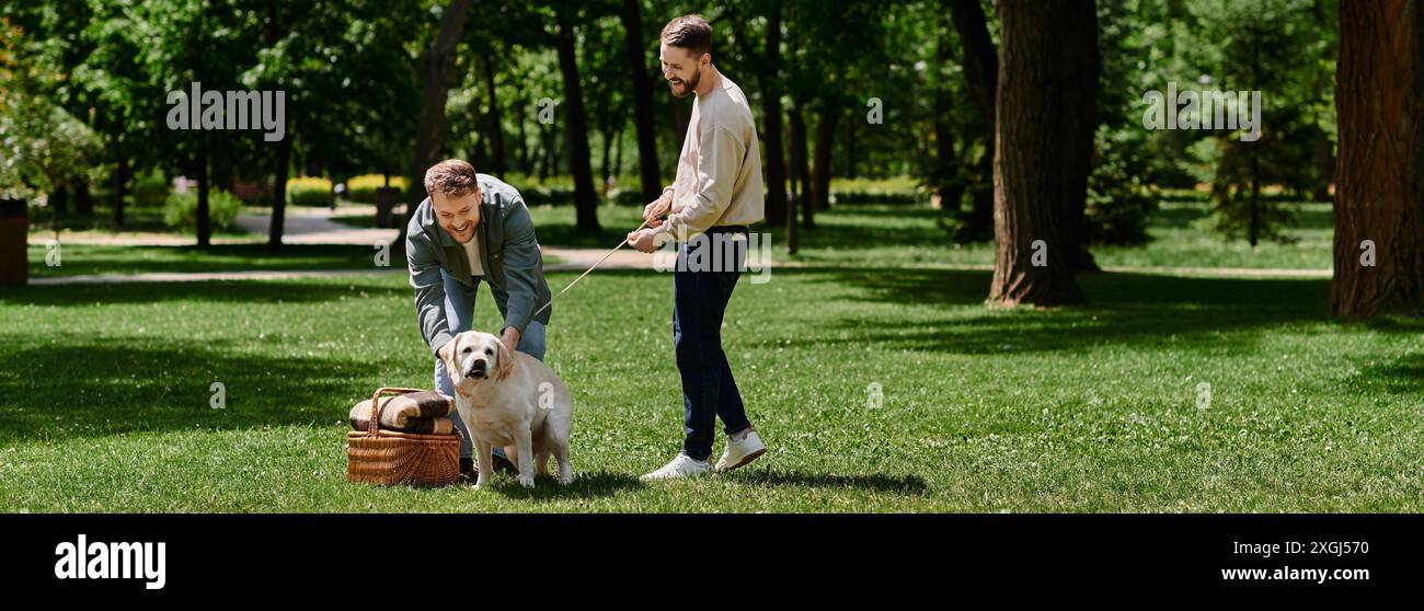 Two men with beards walk their labrador retriever through a green park ...