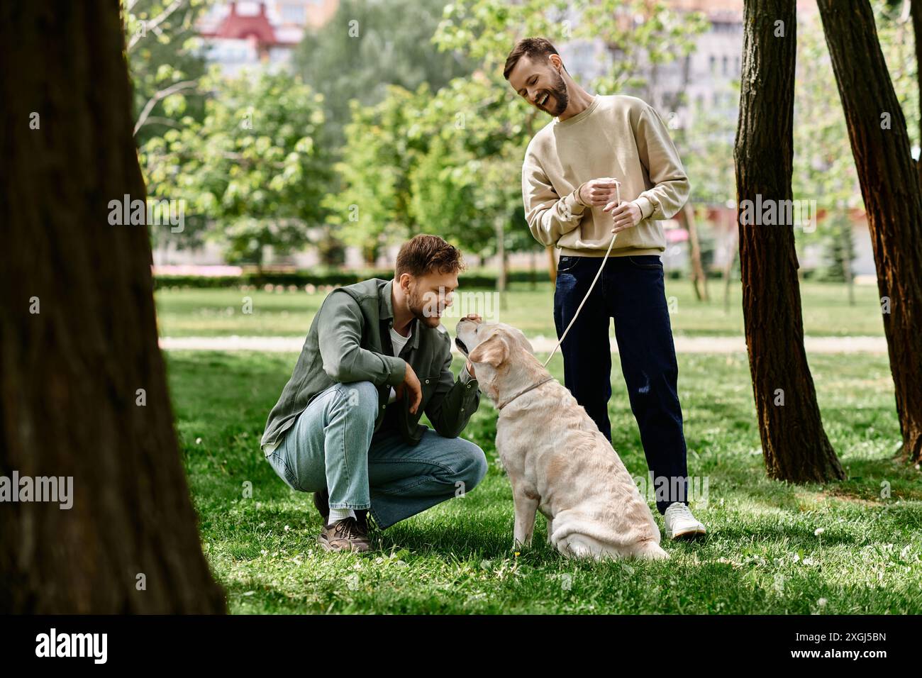 A bearded gay couple is enjoying a sunny afternoon in the park with ...