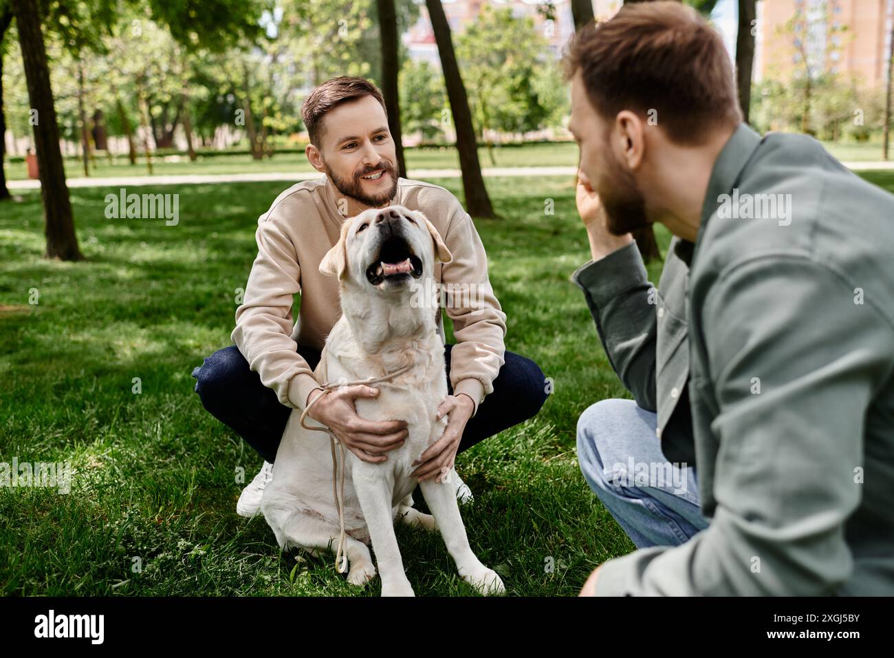 A bearded gay couple enjoys a sunny afternoon in the park with their ...