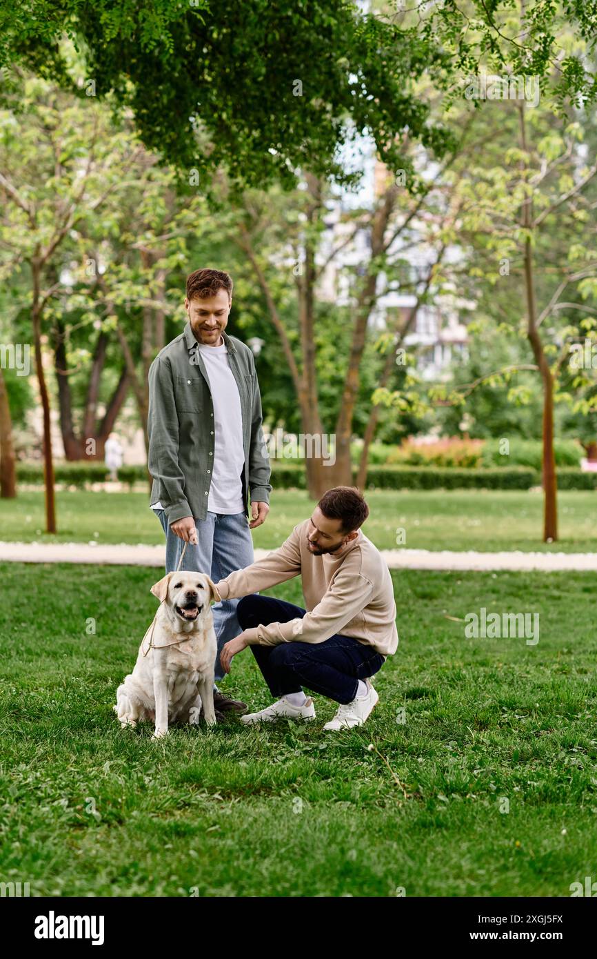 A bearded gay couple spends time with their Labrador retriever in a ...