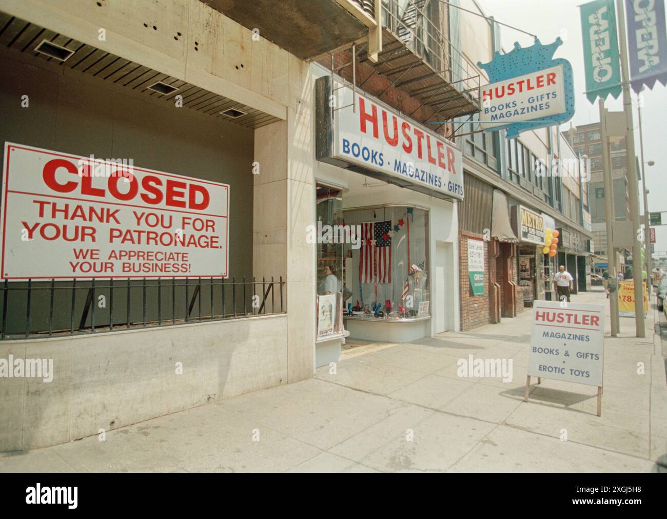 Pedestrians pass the Hustler Books, Magazines and Gifts store in ...