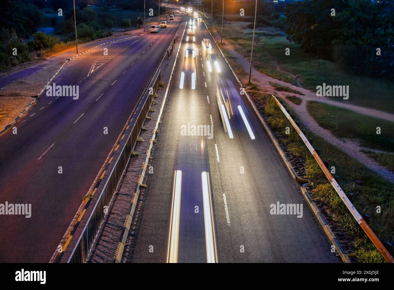 car trail lights in the night viewpoint from above a bridge Stock Photo ...