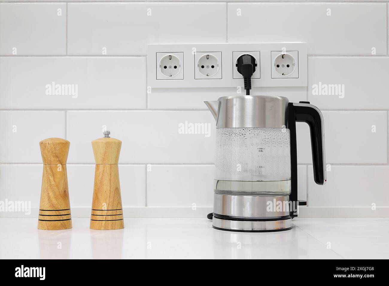Electric kettle on the table in the kitchen close-up Stock Photo - Alamy