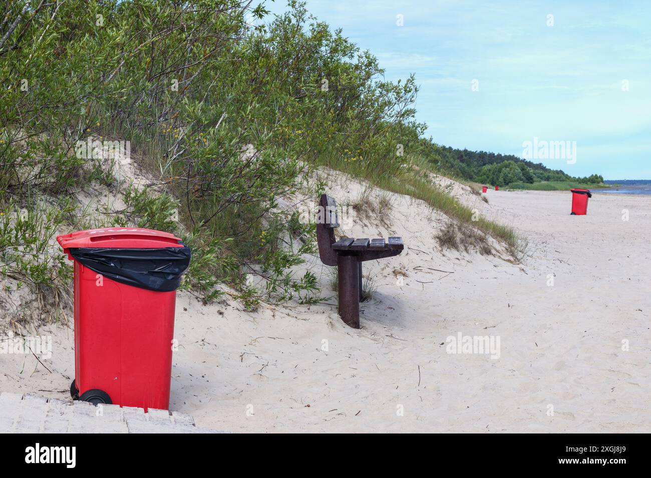 red trash can on the beach Stock Photo - Alamy