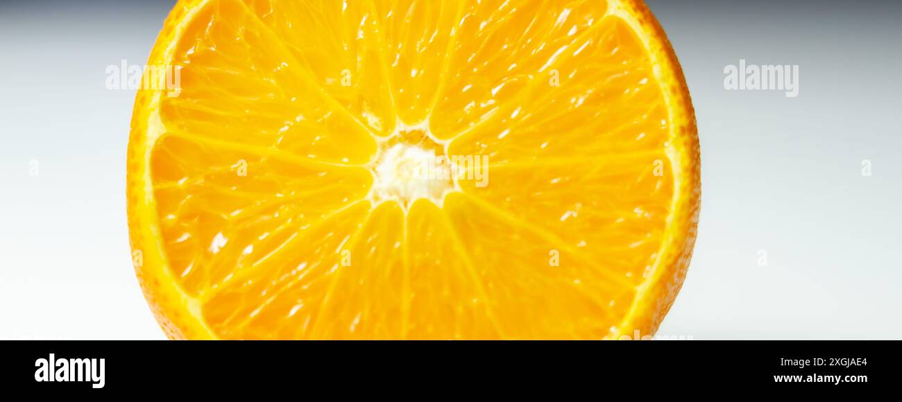 A half of orange with the white part of the fruit visible, healthy food ...