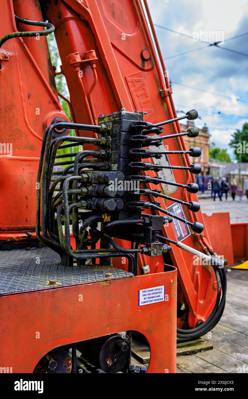 Close-up of heavy machinery control valves and hydraulic system with an ...