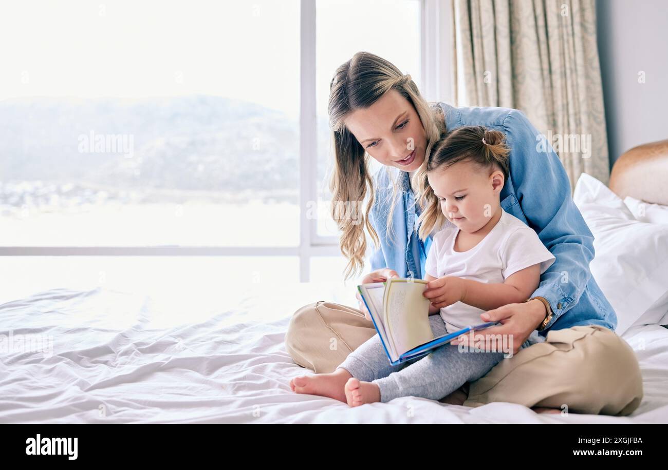 Mother, girl and reading book for story on bed, literacy and learning ...