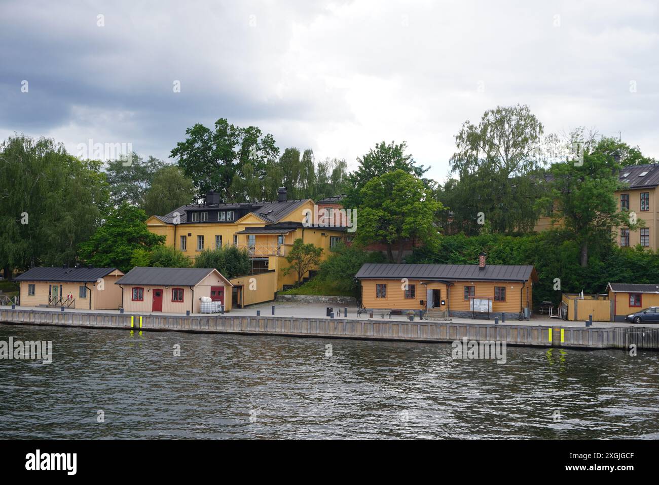 Old buildings by the water Stock Photo - Alamy