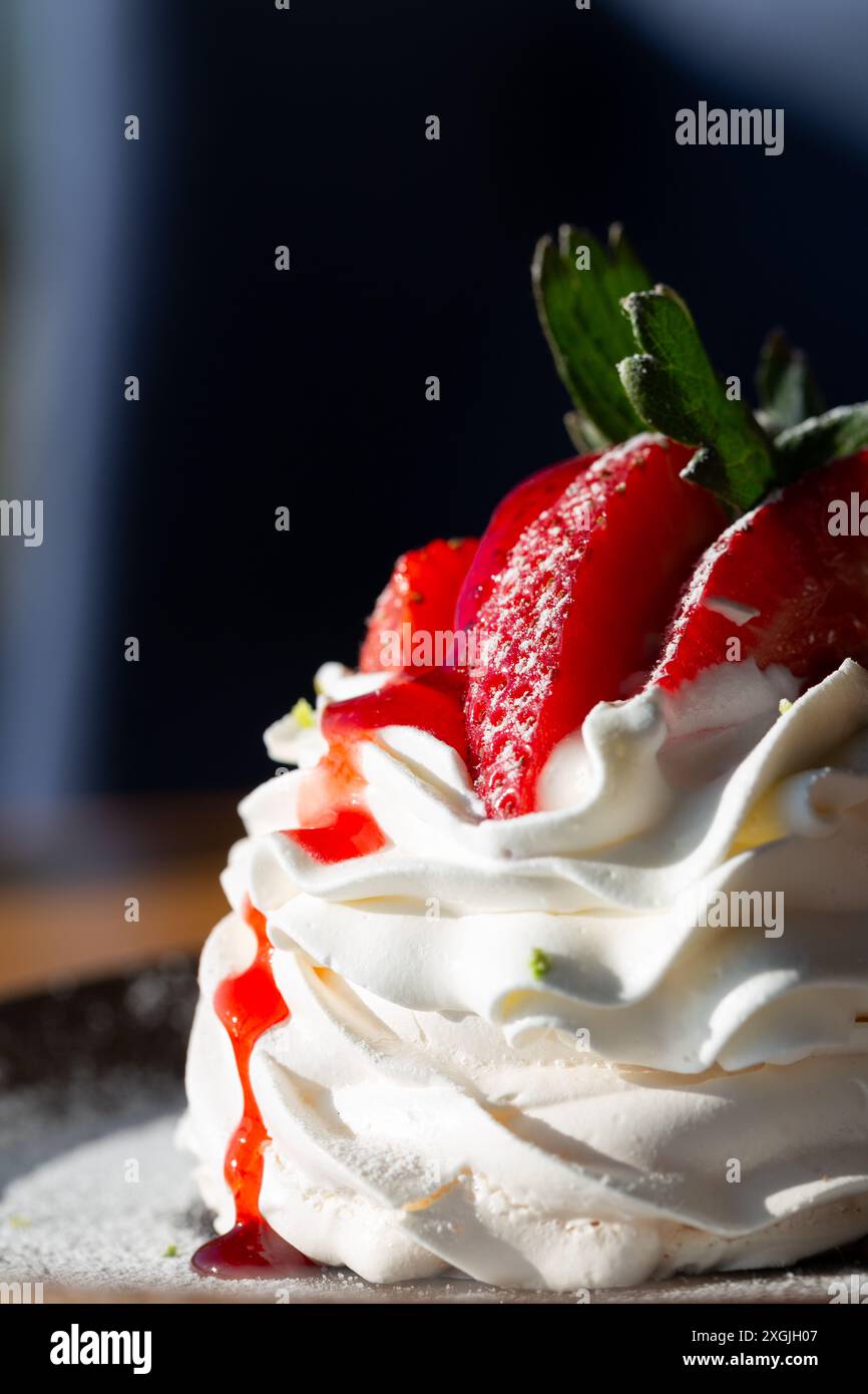 Pavlova cake with strawberries. Anna Pavlova dessert of meringue and ...