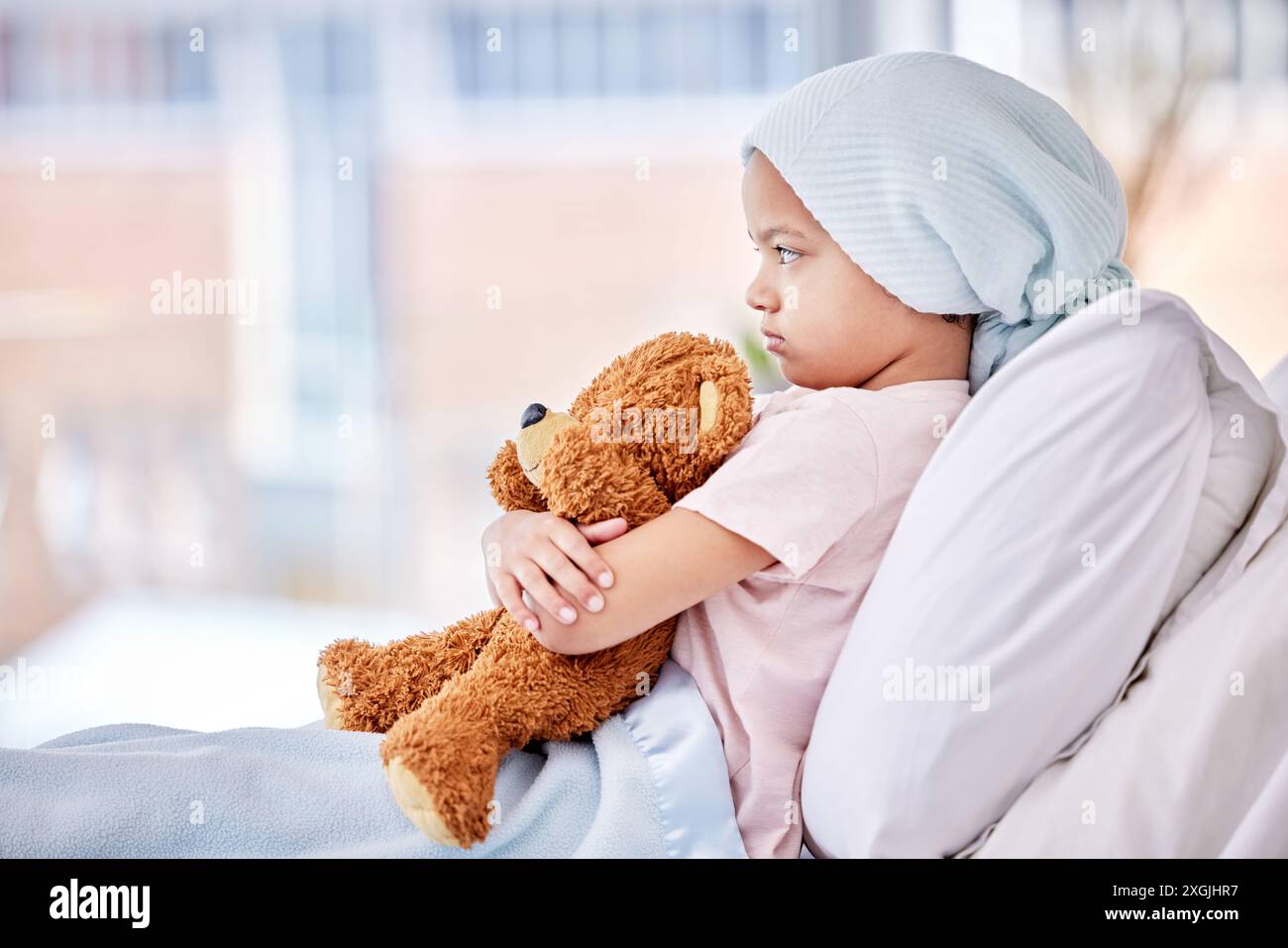 Teddy bear, sick and child in bed at hospital in recovery with ...