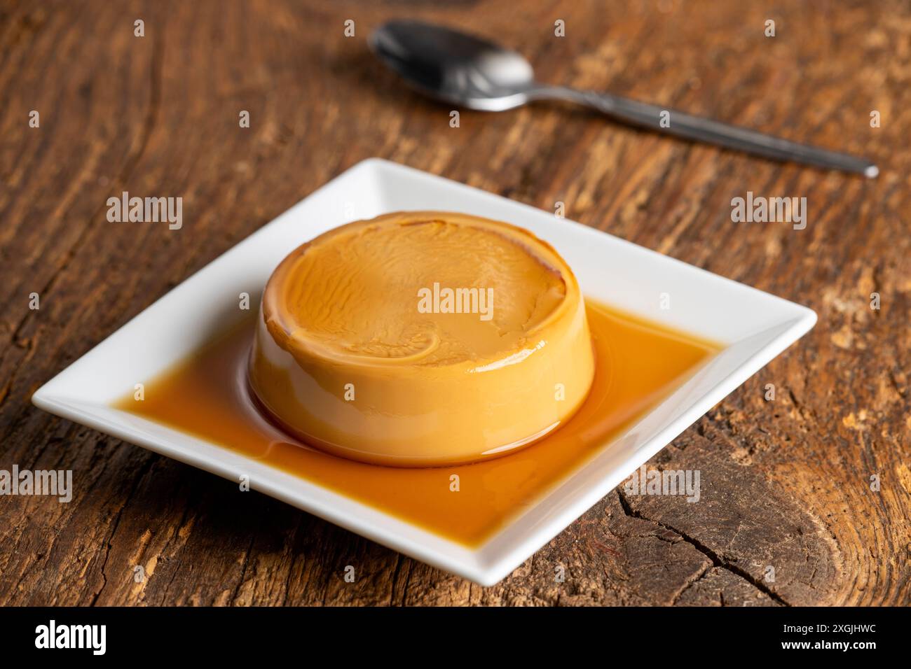 french flan on dark wood Stock Photo - Alamy