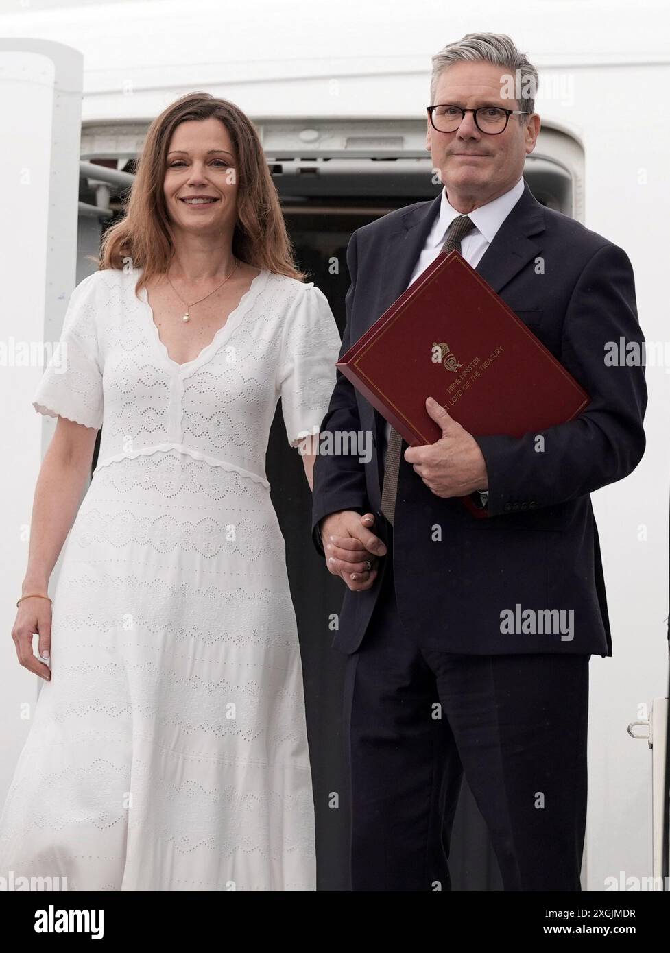 Britain's Prime Minister Keir Starmer and his wife Victoria board a ...