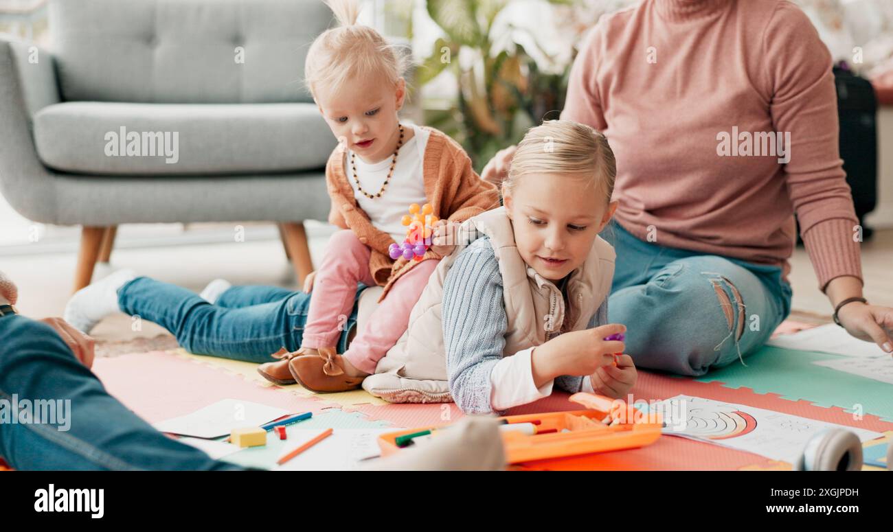 Kids, parents and drawing for education on floor with family bonding ...