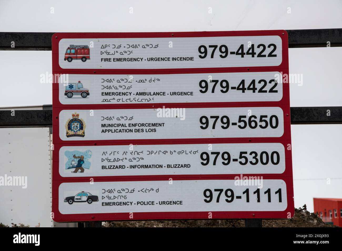 Multilingual emergency telephone numbers sign in English, French and ...