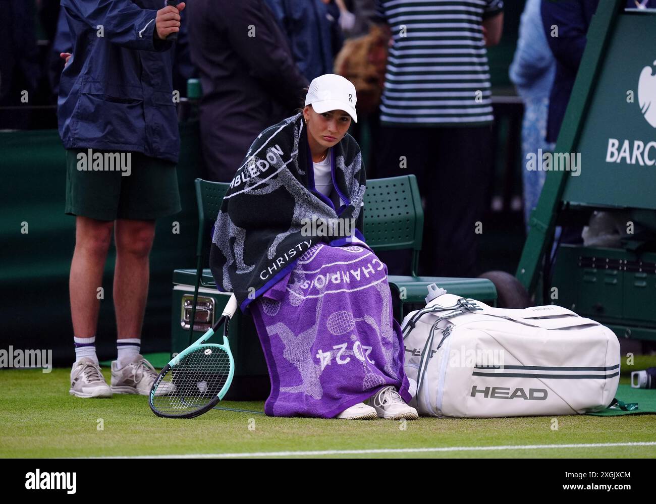 Julia Stusek wrapped up in towels as she waits for her match to start ...
