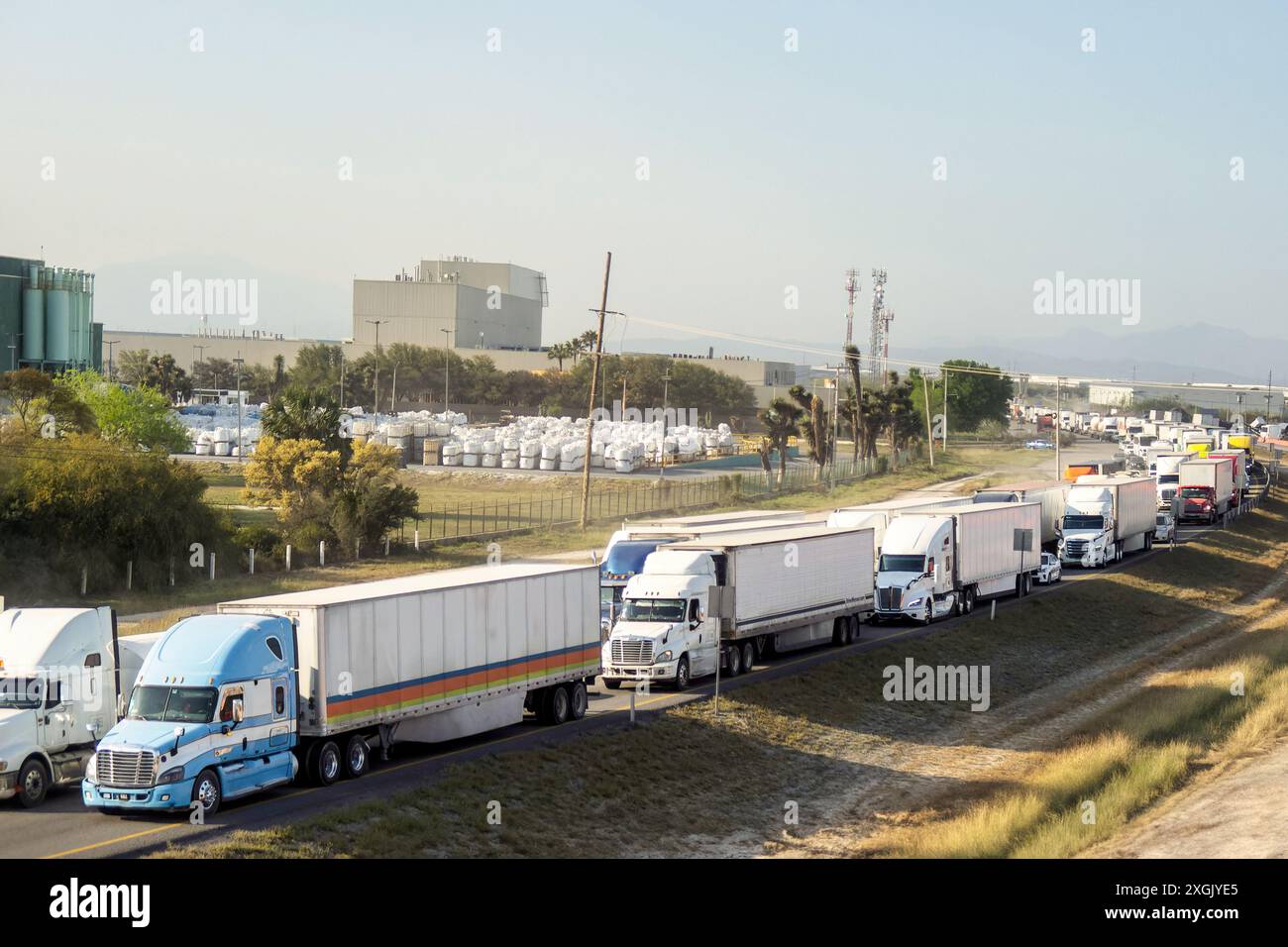Group of trailers stuck in traffic on a highway Stock Photo - Alamy