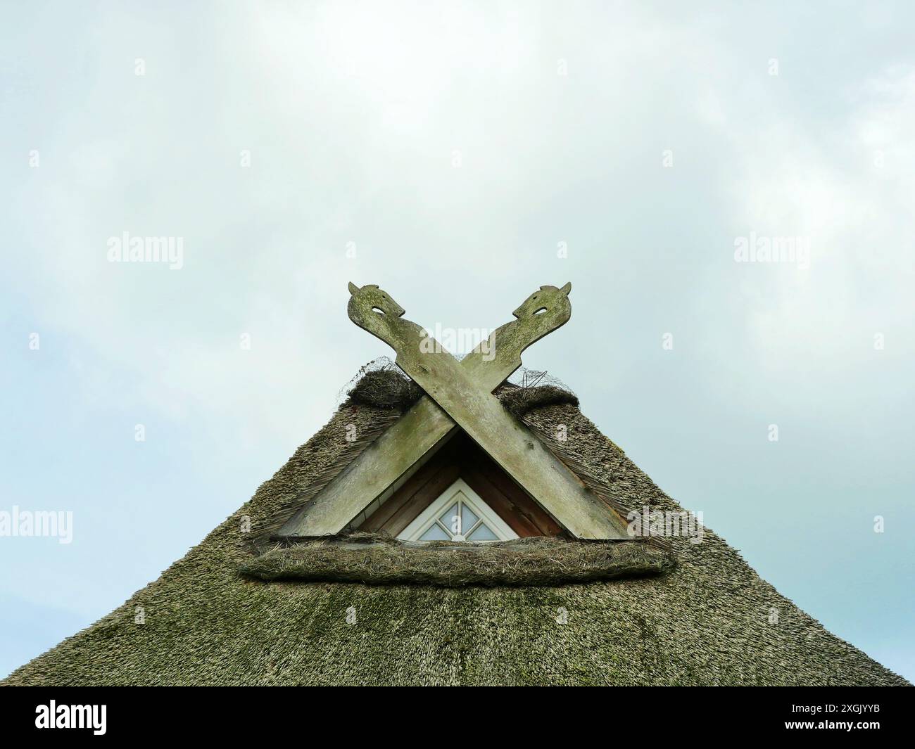 The typical historical gable ornaments on old buildings, featuring two ...