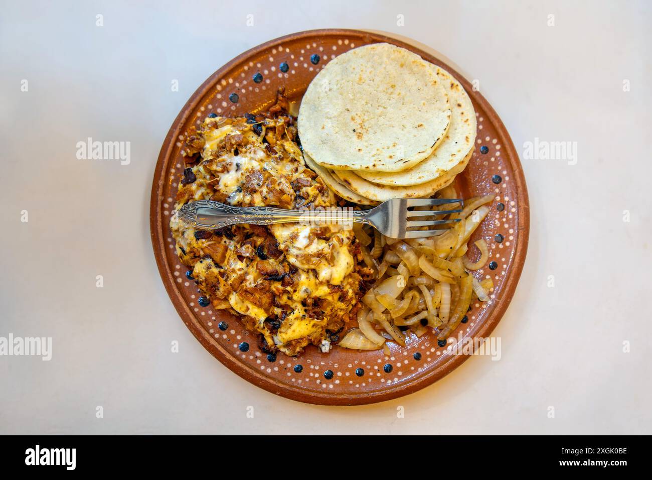 Delicious Mexican alambre with seasoned carne al pastor, served with ...