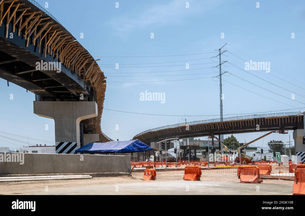 Dynamic view of a construction site featuring a modern highway overpass ...