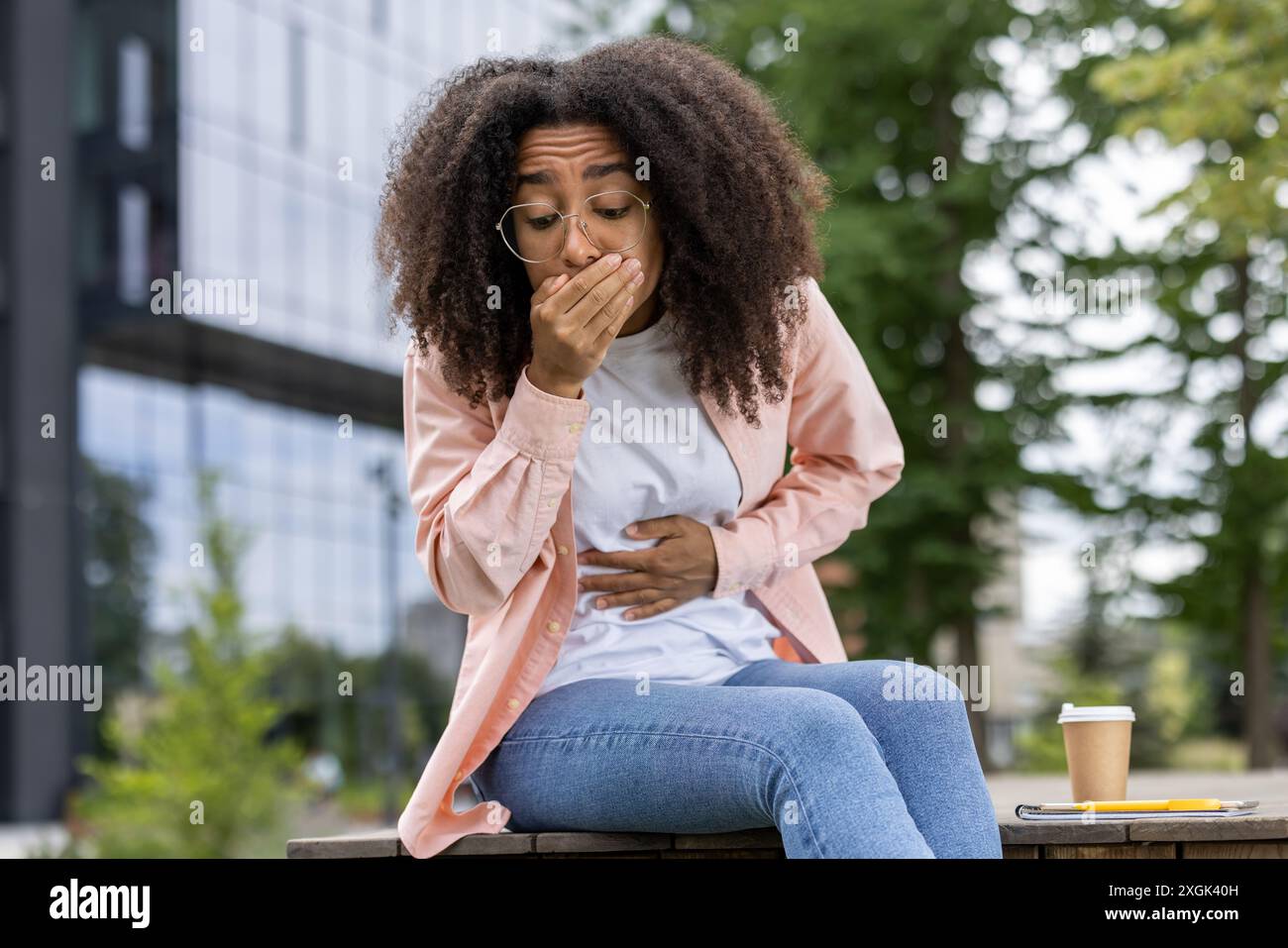 Woman vomiting hand over mouth hi-res stock photography and images - Alamy