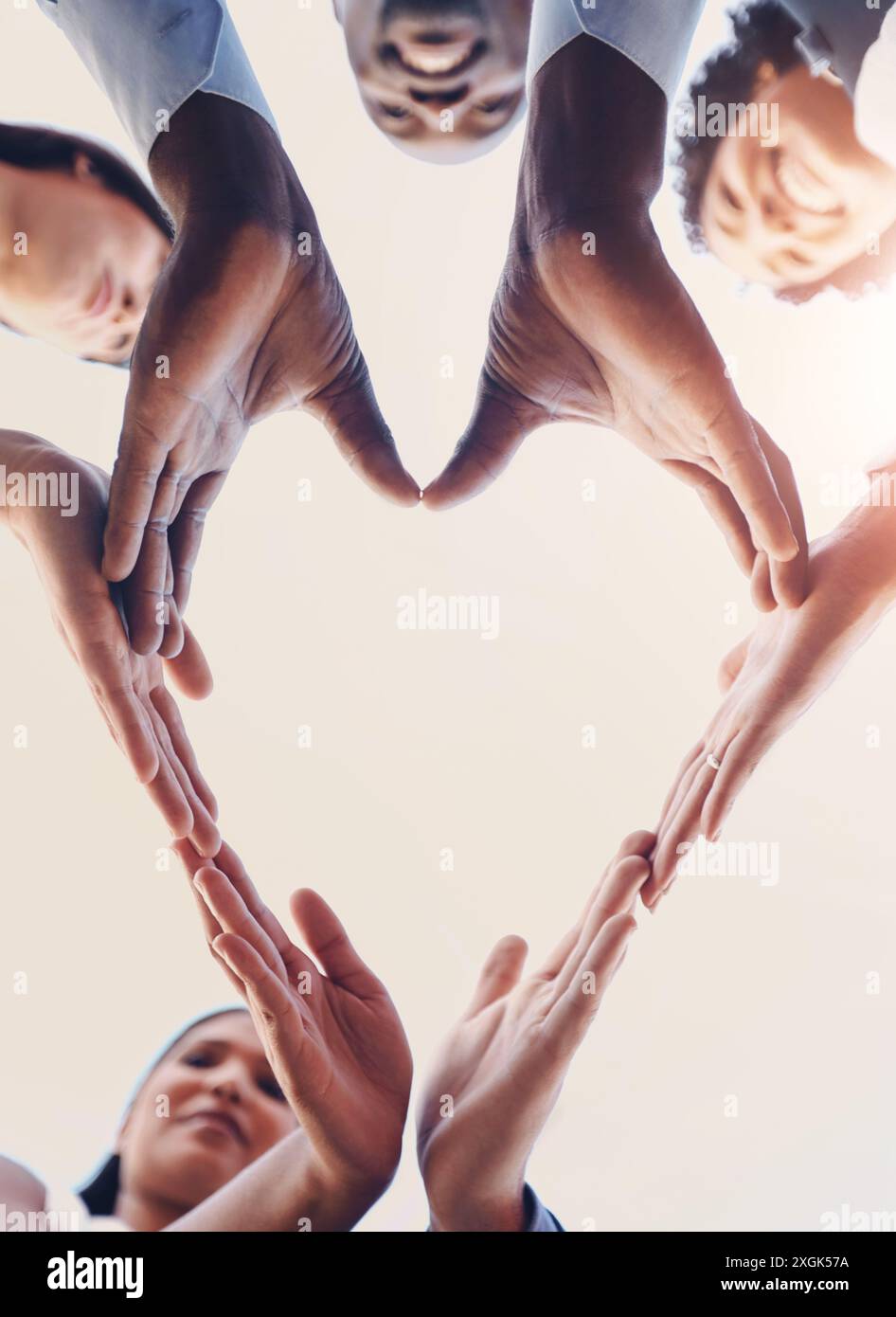 Heart, teamwork and hands of business people in support, unity or ...