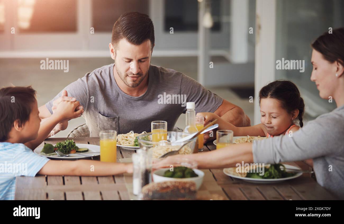 Loving family praying together in hi-res stock photography and images ...