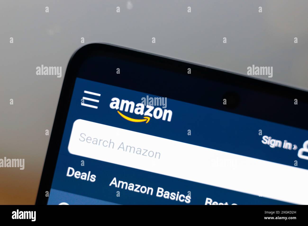 In this photo illustration, the Amazon logo is displayed on the website ...
