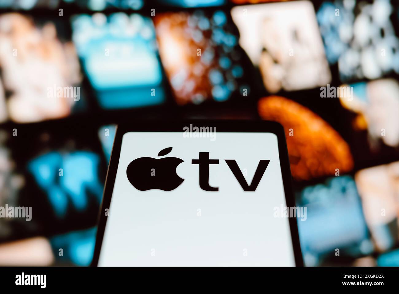In this photo illustration, an Apple TV logo is displayed on a smartphone screen Stock Photo - Alamy